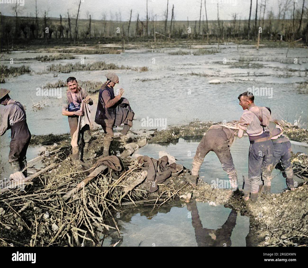 British soldiers washing and cleaning up in a swamp on the Somme ...