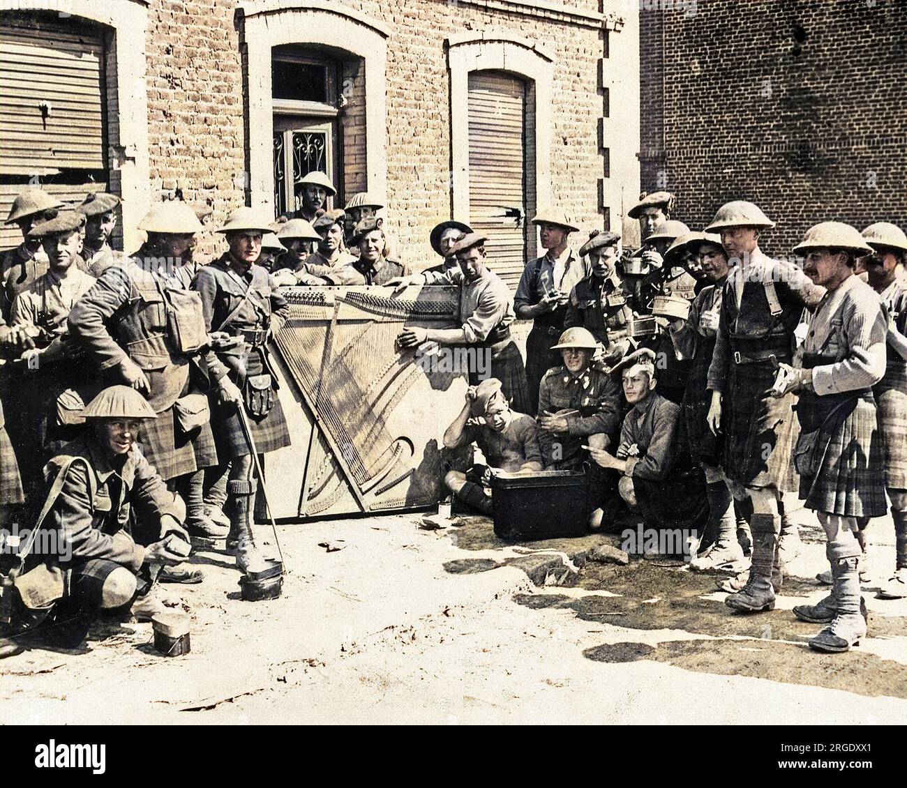 Allied soldiers relaxing with refreshments and music from a piano on ...