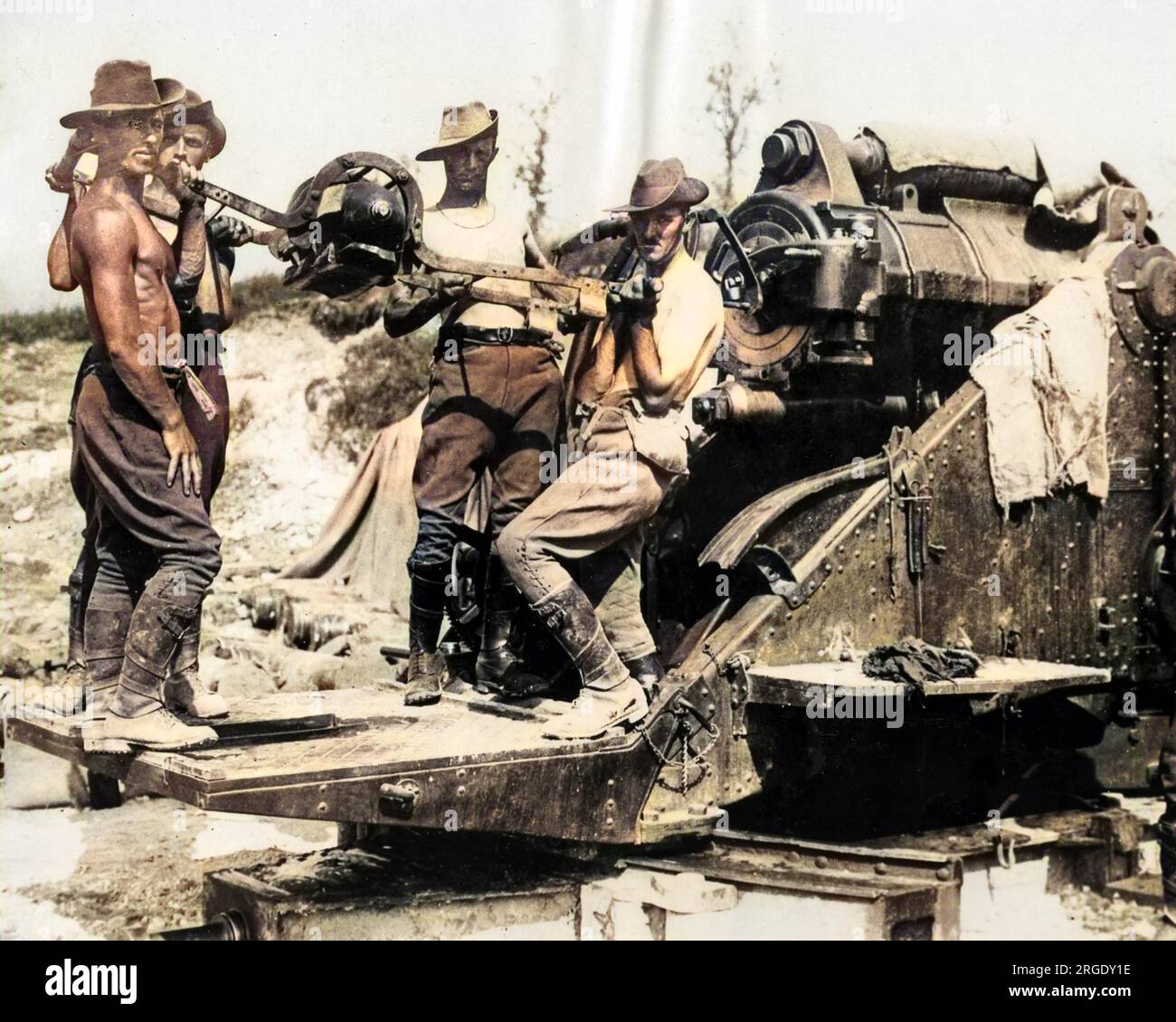Australian gunners loading shells into a big gun during hot weather on ...