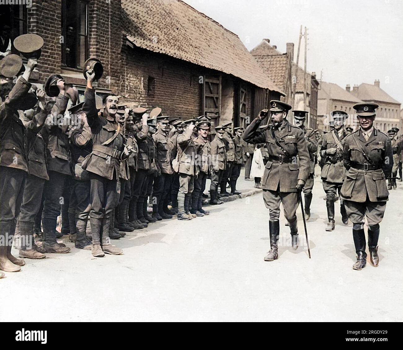 King George V saluting troops on a visit to the Western Front during ...