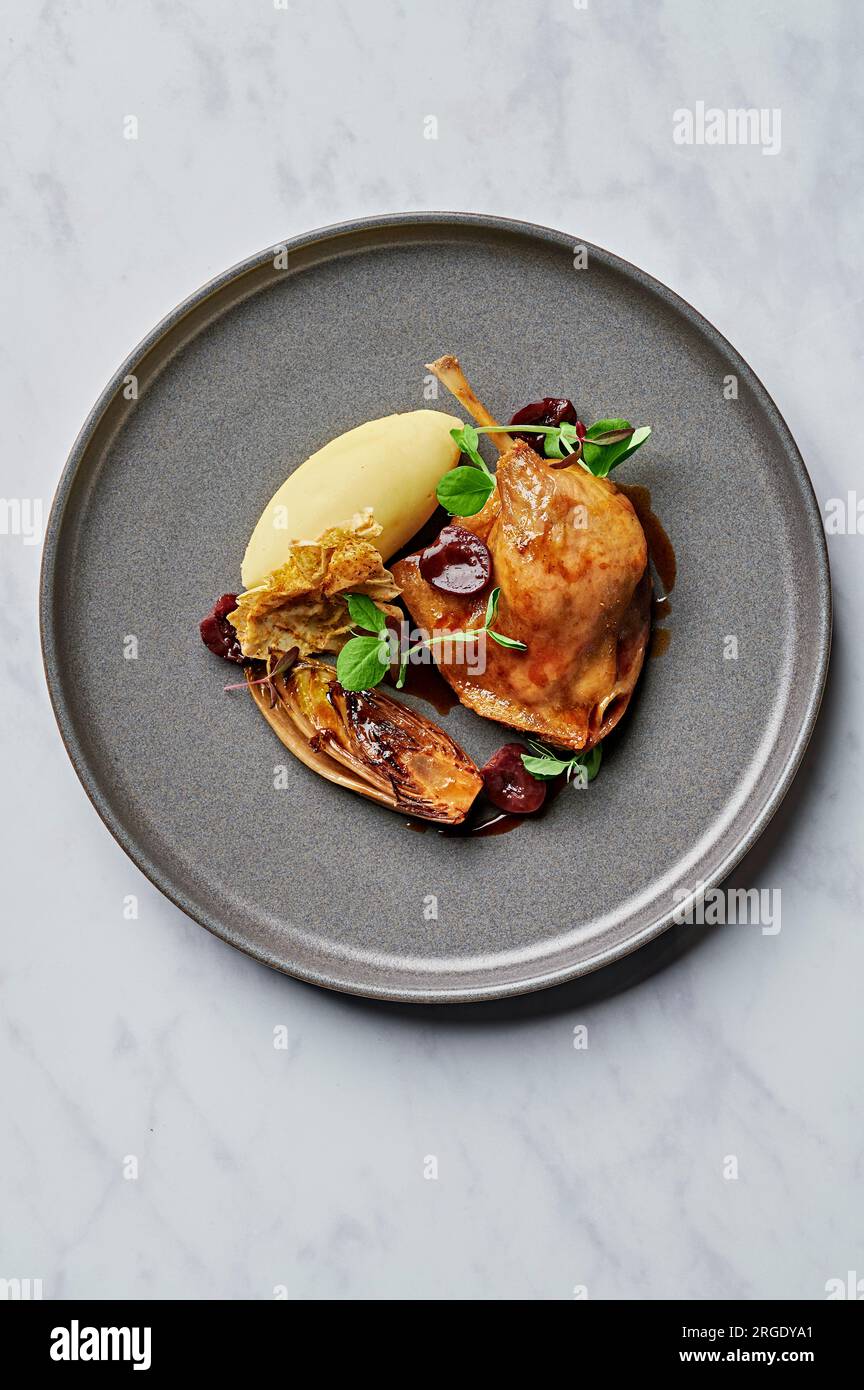 Confit duck leg, creamy mash, caramelised witlof, sour cherry jus ...
