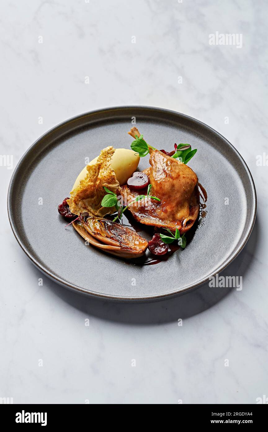 Confit duck leg, creamy mash, caramelised witlof, sour cherry jus ...