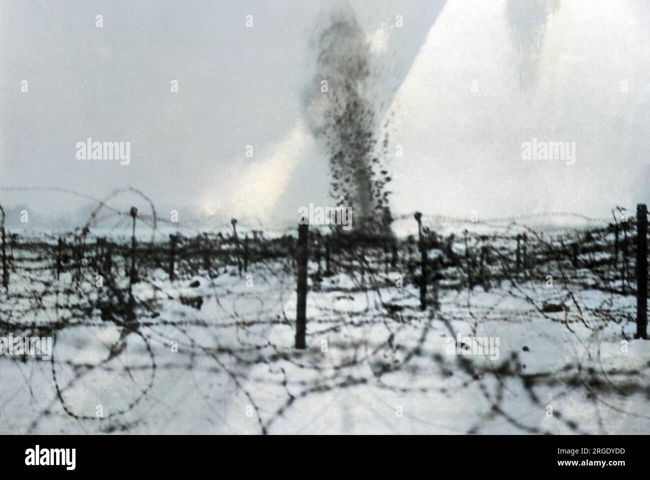 A shell bursting on a front line trench on the Western Front in France ...