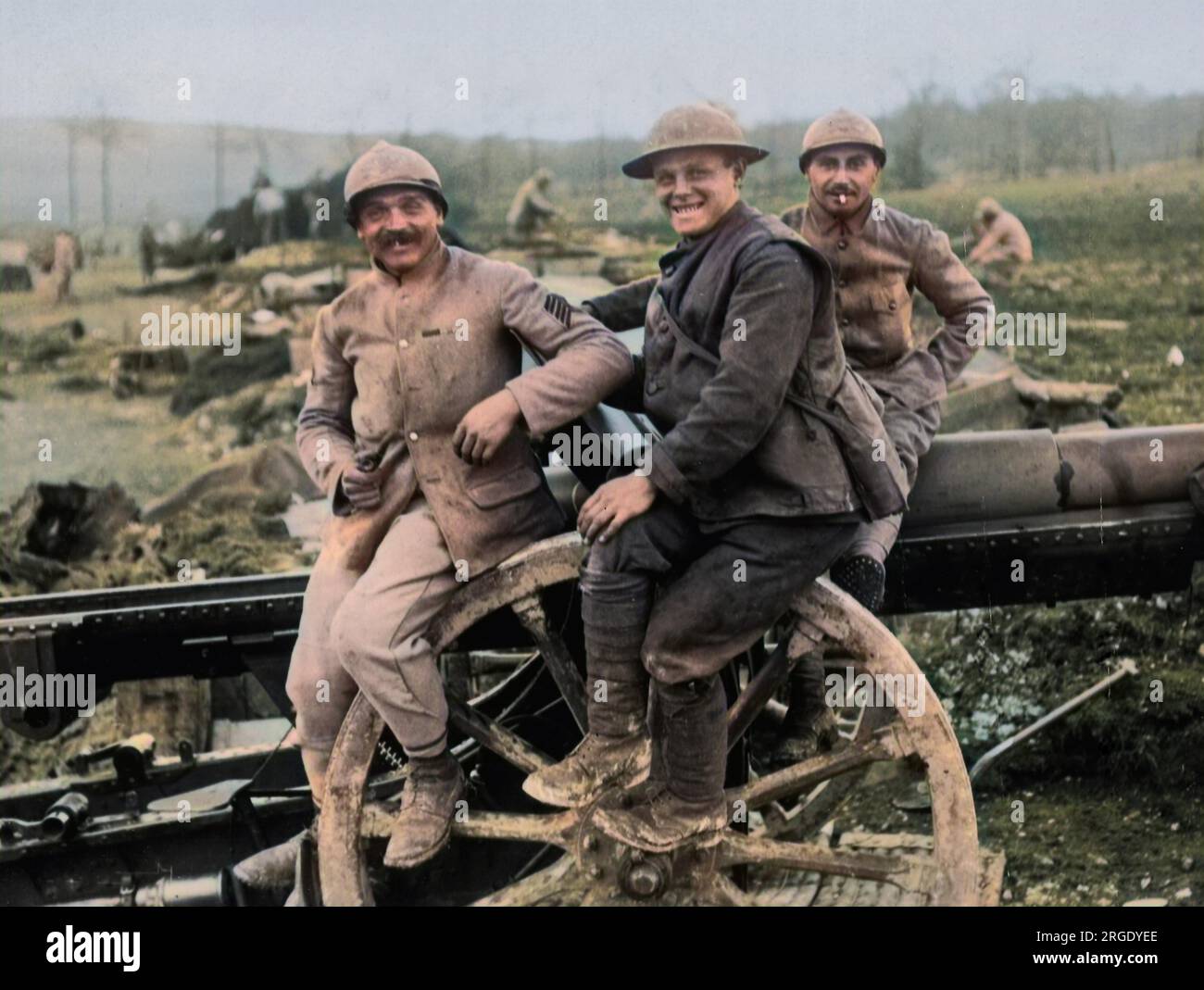 British and French gunners sitting on the wheel of a field gun on the ...