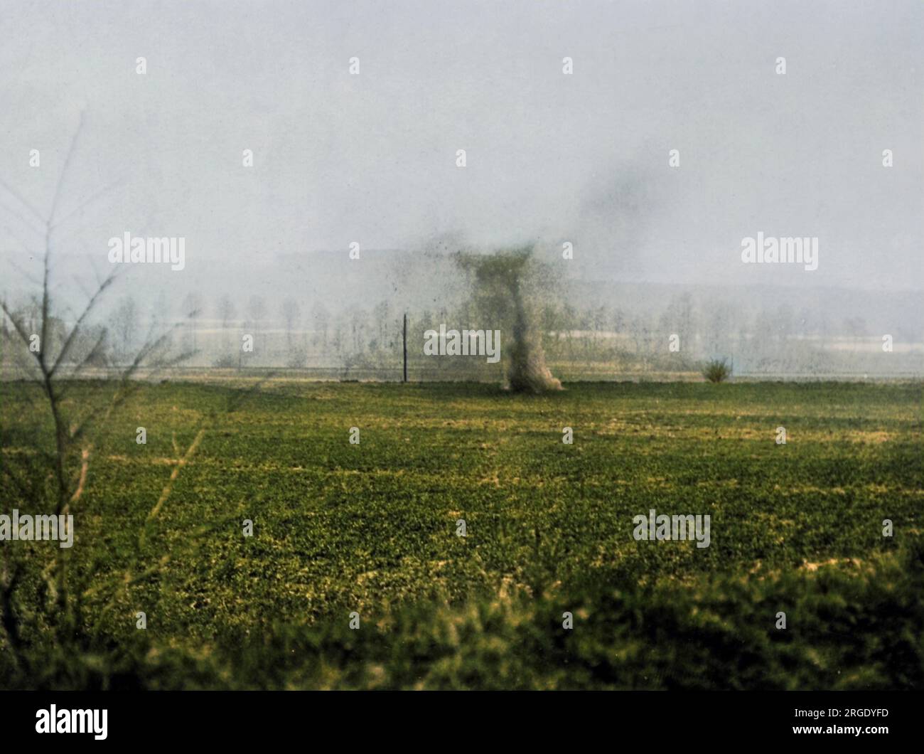 German shell exploding in a field on the Western Front in France during ...