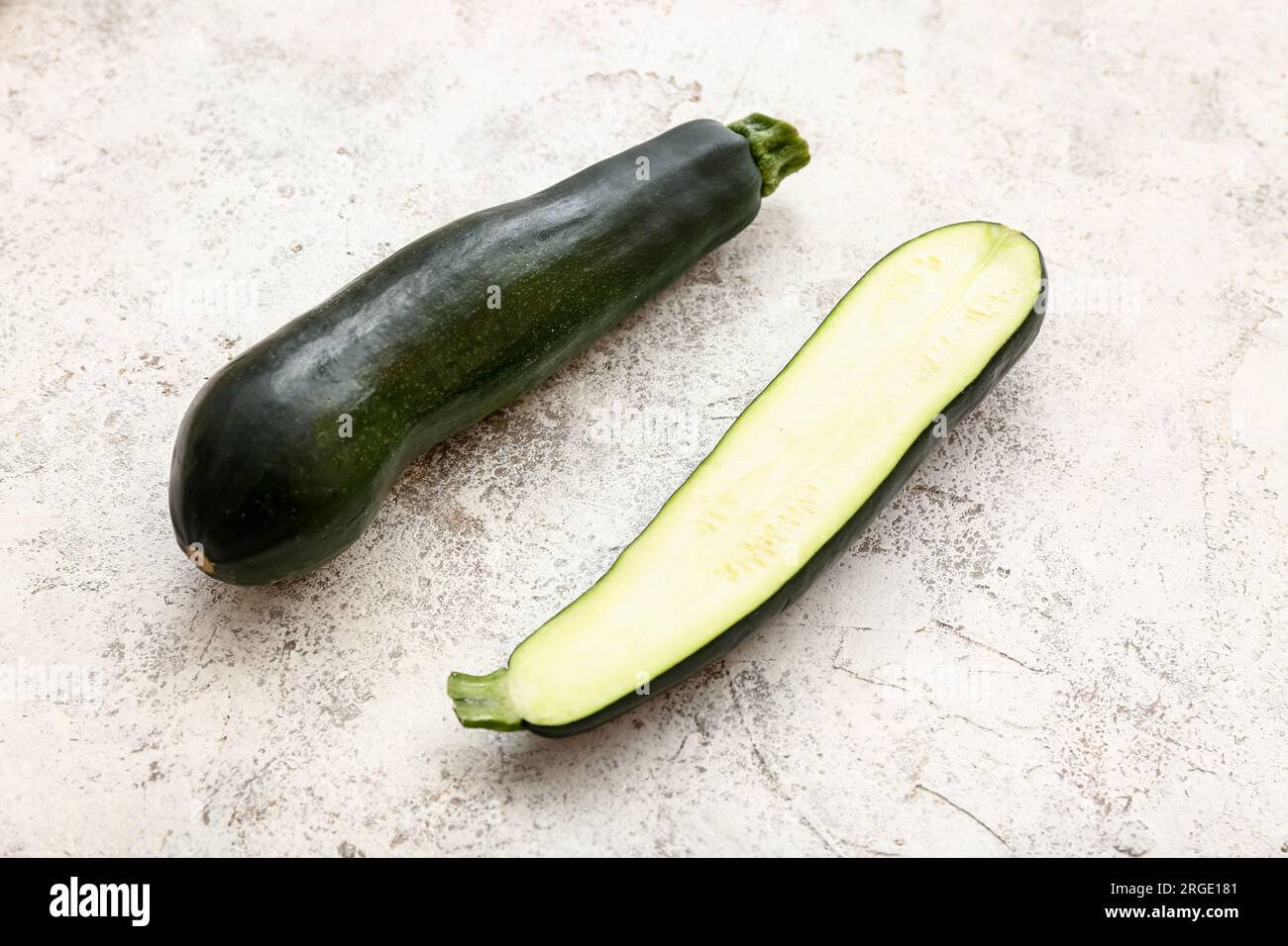 Fresh green zucchini on white background Stock Photo - Alamy