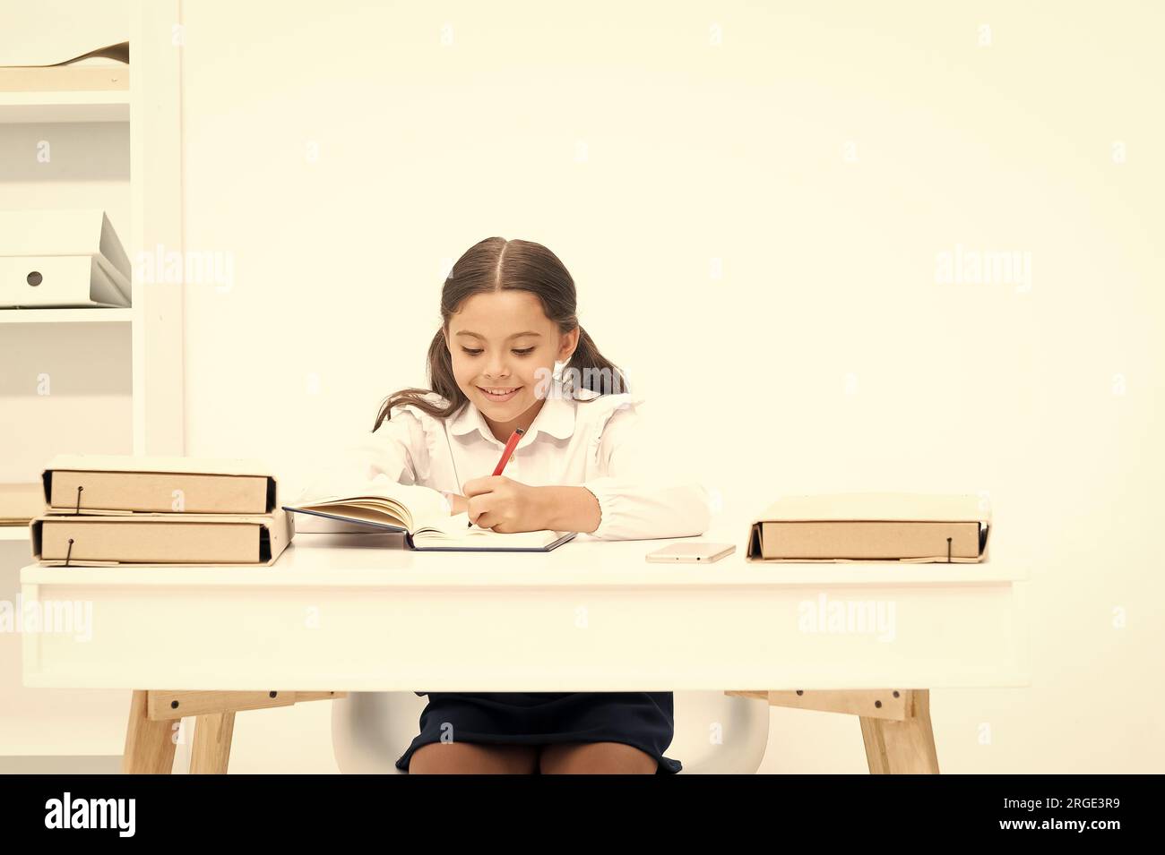 positive teen school girl noting in classroom. teen school girl noting ...
