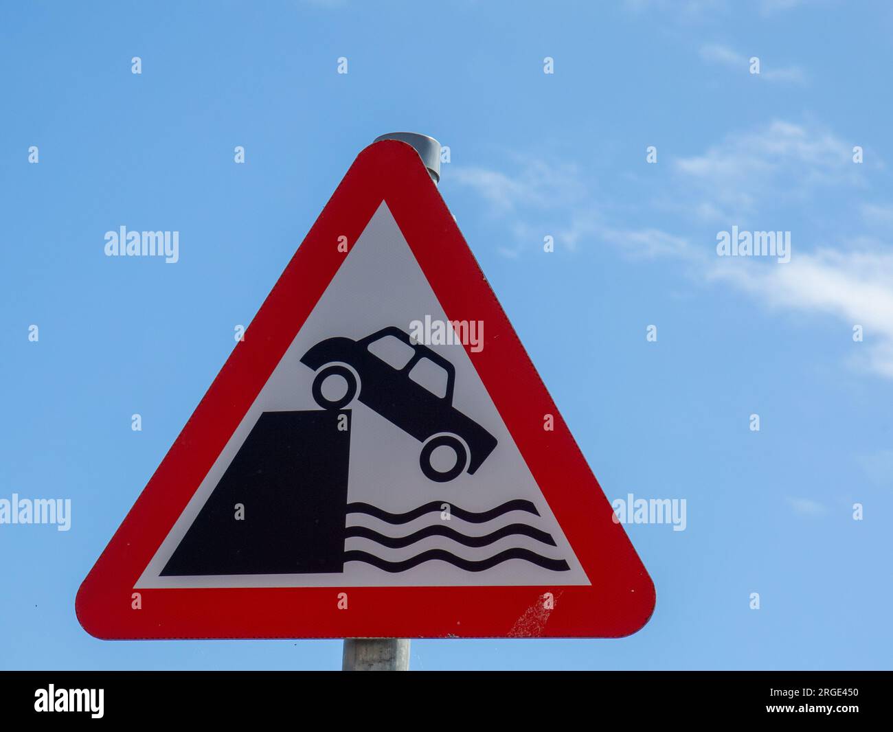 Warning of danger triangular road sign of harbour risk to vehicles ...