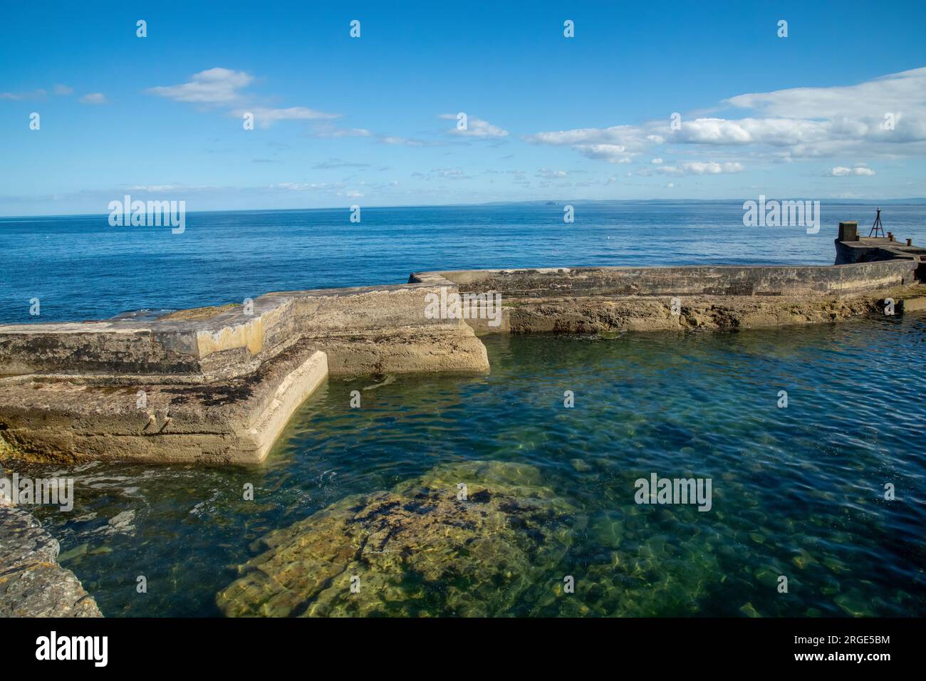 Saint Monan's zig zag pier in Fife with blue ocean and sky Stock Photo ...
