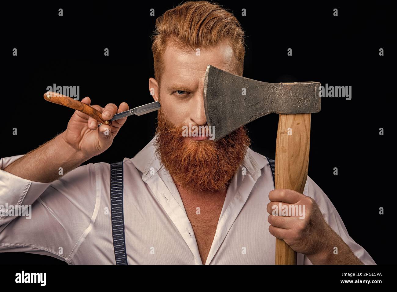 barber man in studio. barber man with ax and retro razor blade. photo ...