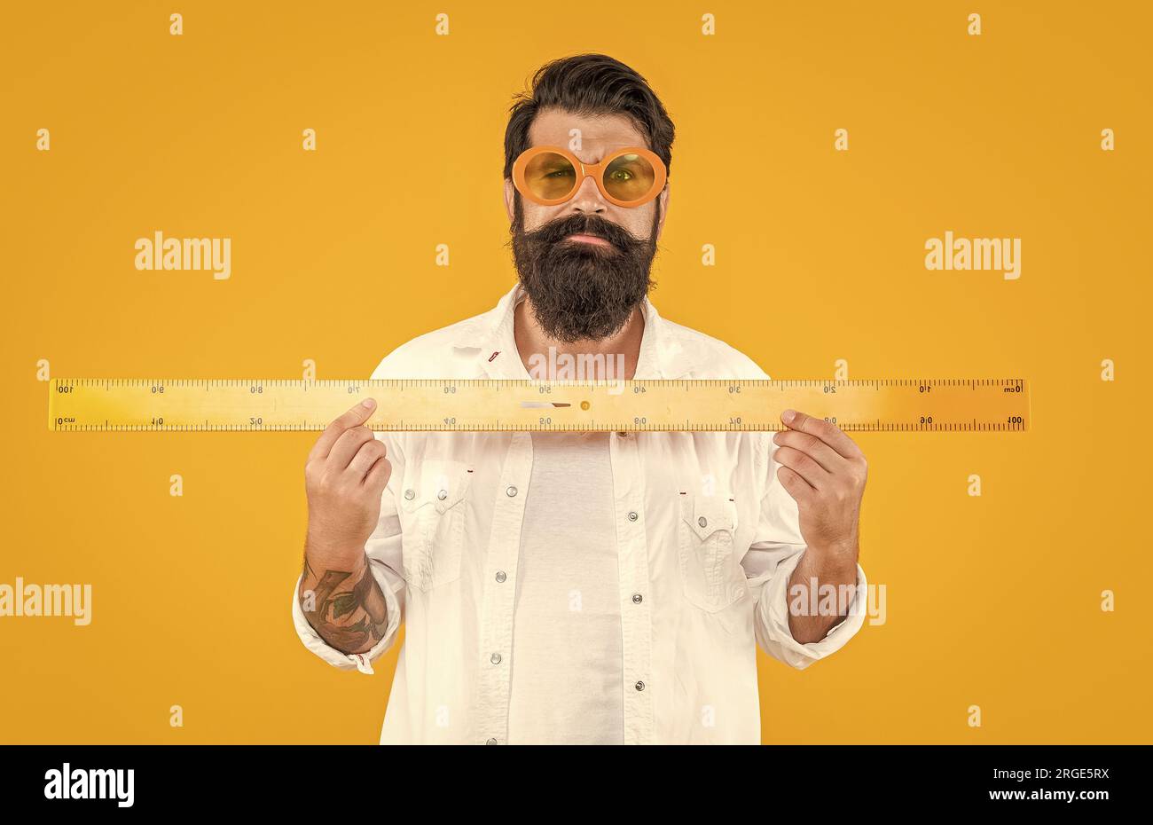 confused school man measure with ruler isolated on yellow. school man ...