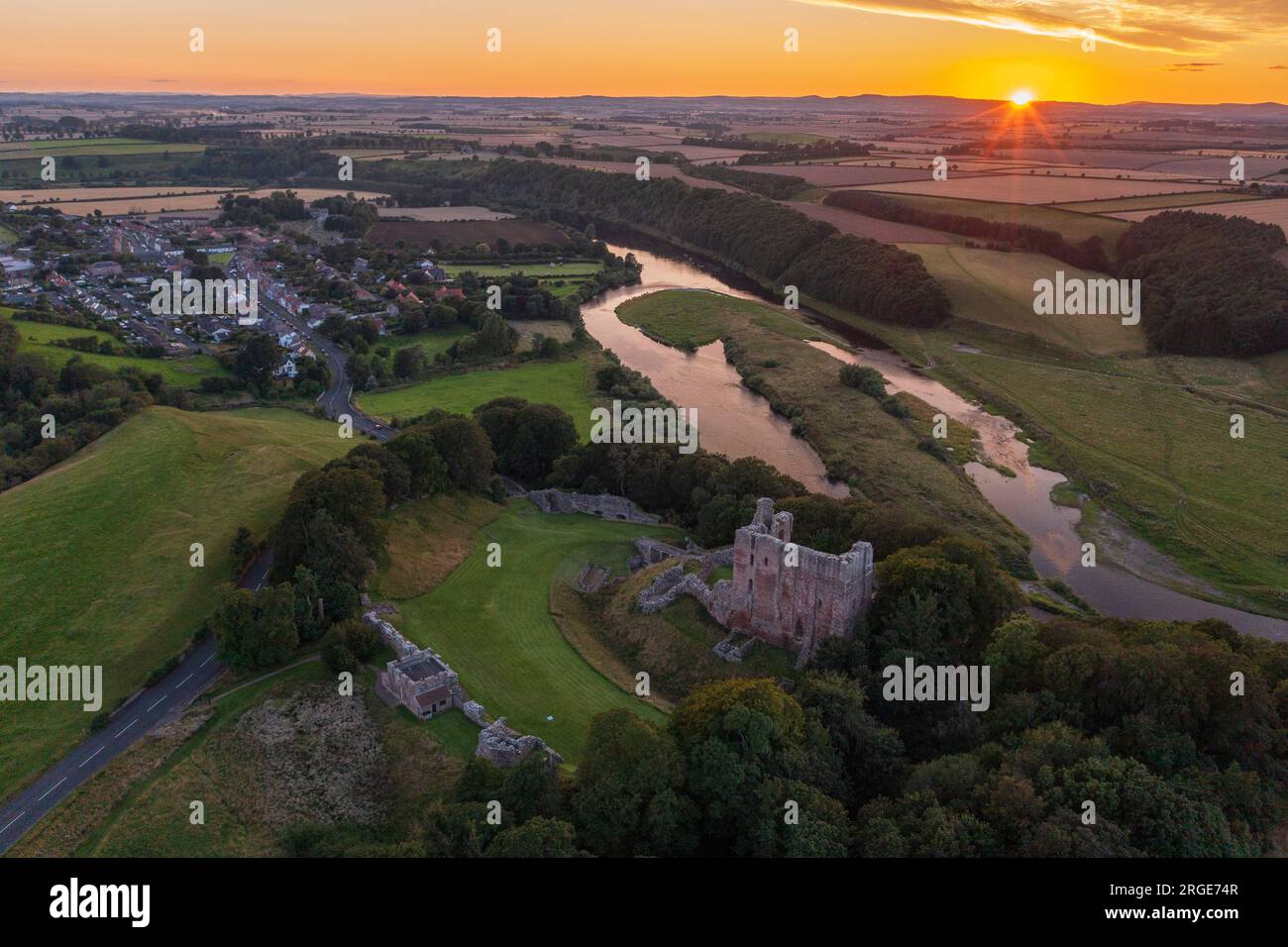 Sunset at Norham Castle sitting high above the River Tweed on the ...