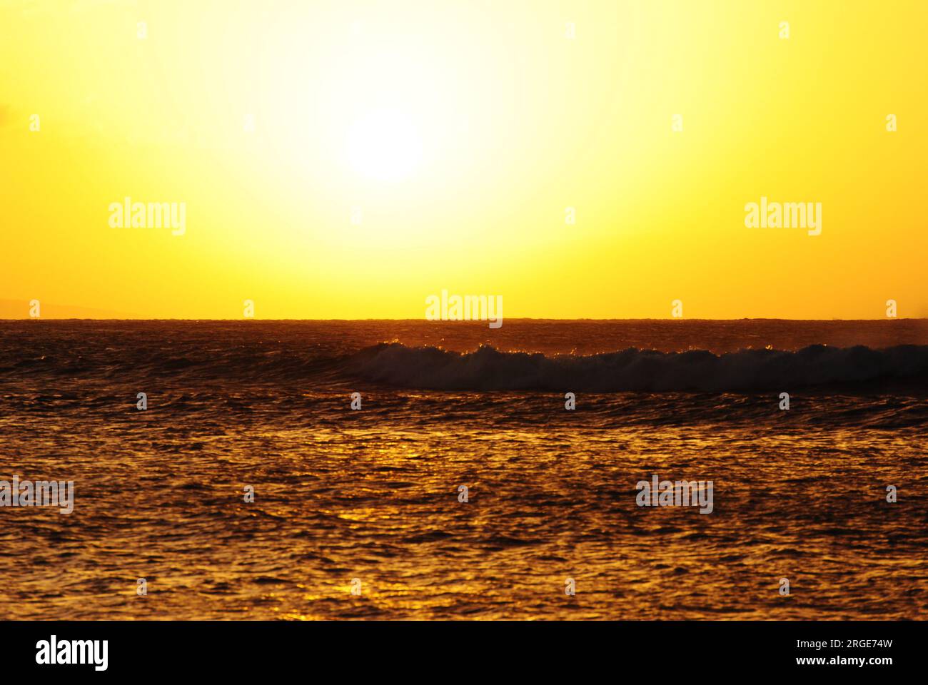 Melting Sun - Maui Sunset Stock Photo - Alamy