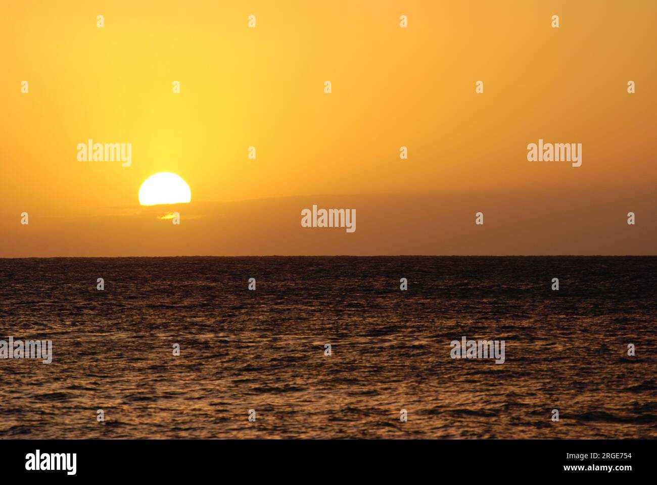 Melting Sun - Maui Sunset Stock Photo - Alamy