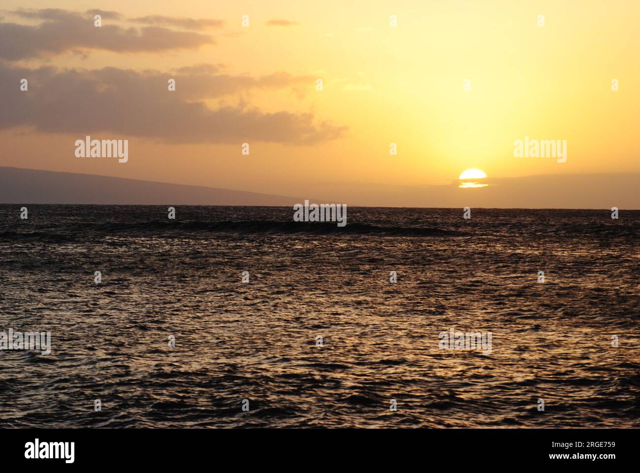 Melting Sun - Maui Sunset Stock Photo - Alamy