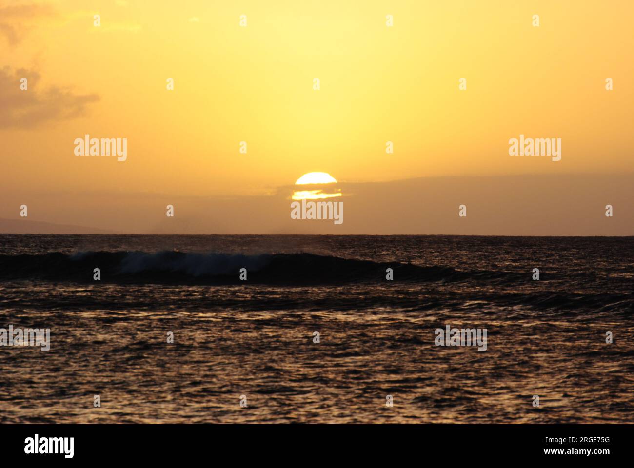 Melting Sun - Maui Sunset Stock Photo - Alamy