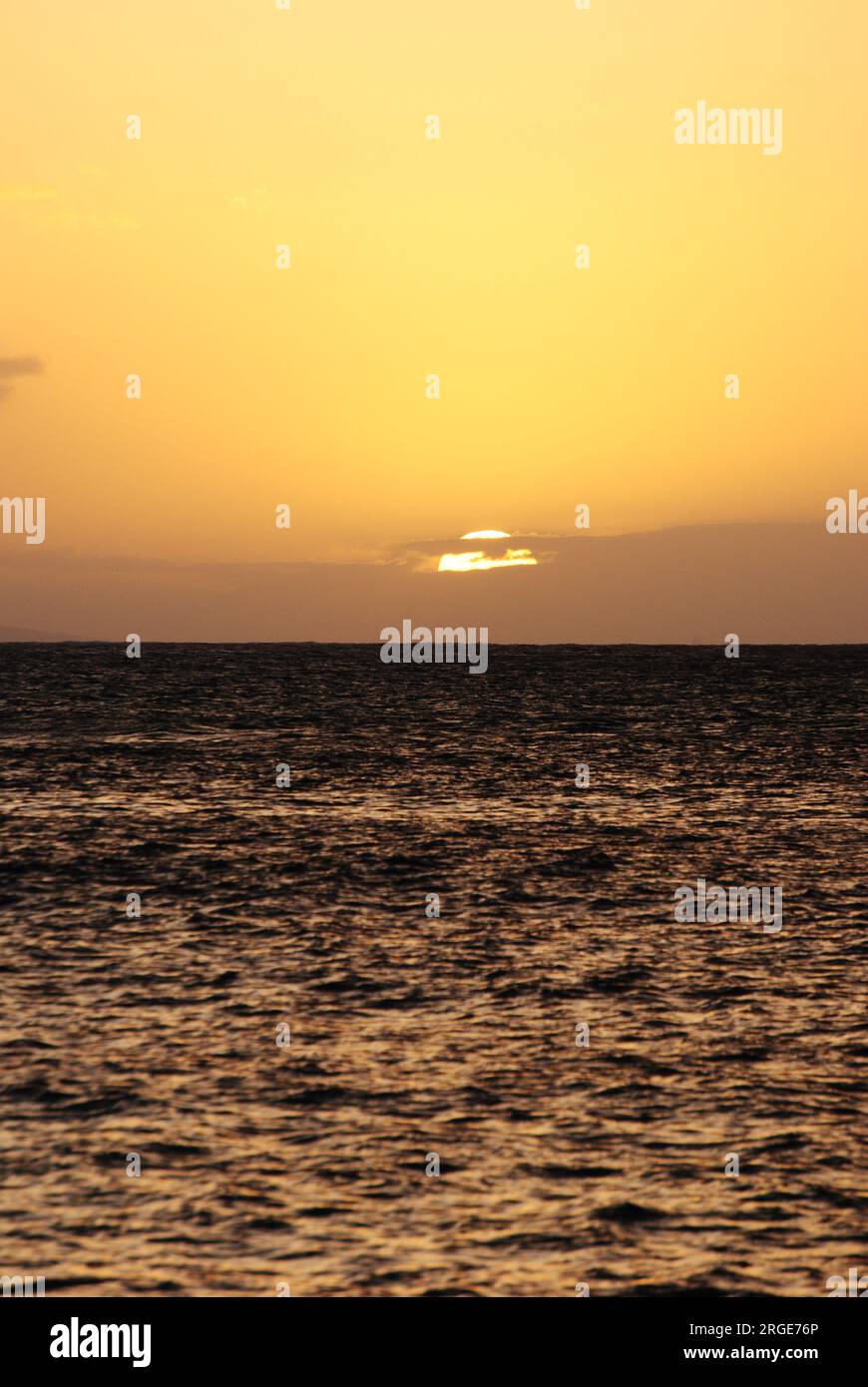 Melting Sun - Maui Sunset Stock Photo - Alamy