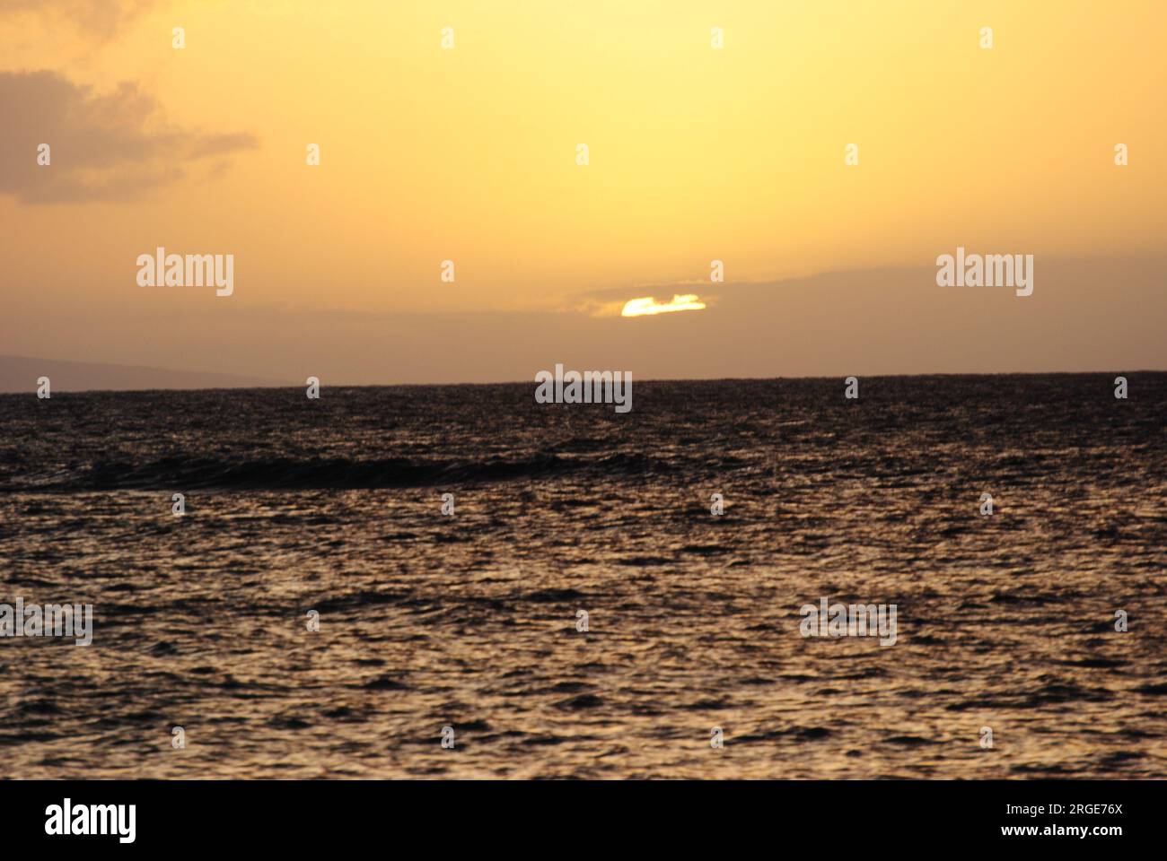 Melting Sun - Maui Sunset Stock Photo - Alamy