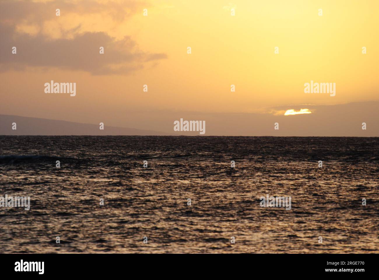 Melting Sun - Maui Sunset Stock Photo - Alamy