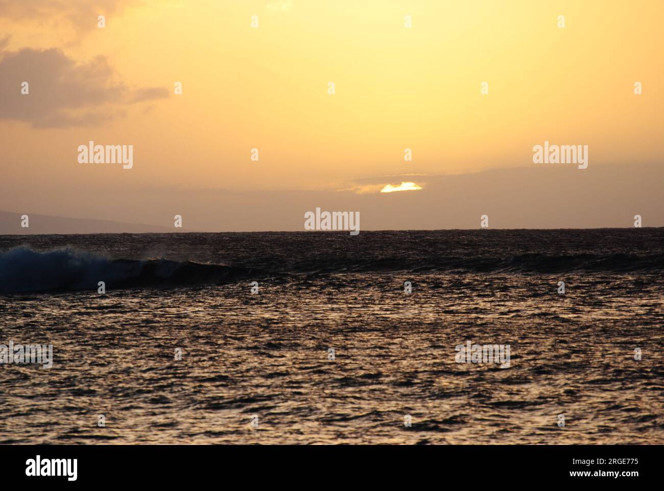 Melting Sun - Maui Sunset Stock Photo - Alamy