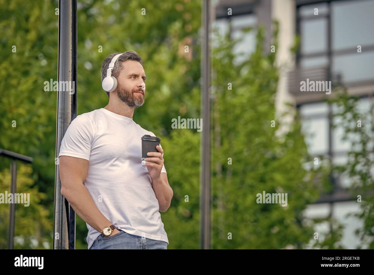 man in music headphones relaxing outside. photo of man in music ...