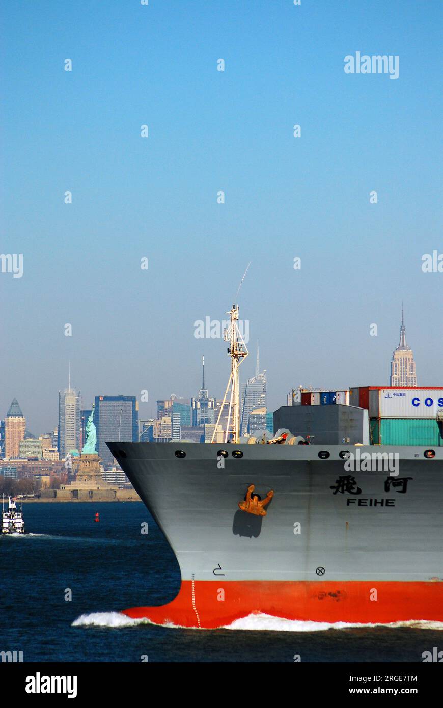 A Chinese container ship travels through New York Harbor, passing the ...