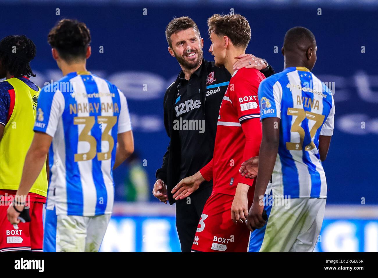 Middlesbrough manager Michael Carrick talks with Rav van den Berg of ...