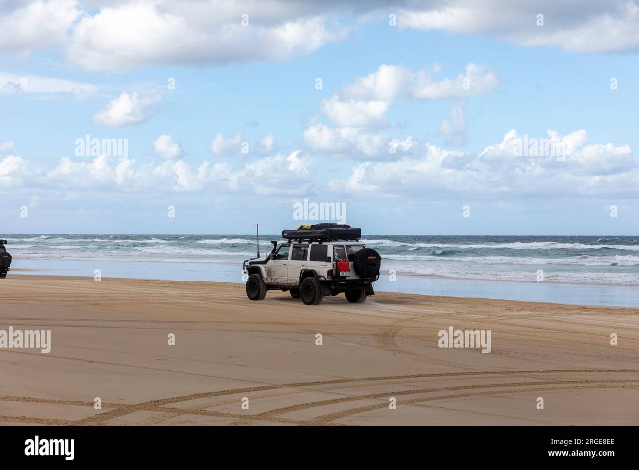 75 mile beach Fraser Island K'gari, 4WD vehicle driving along the sand ...