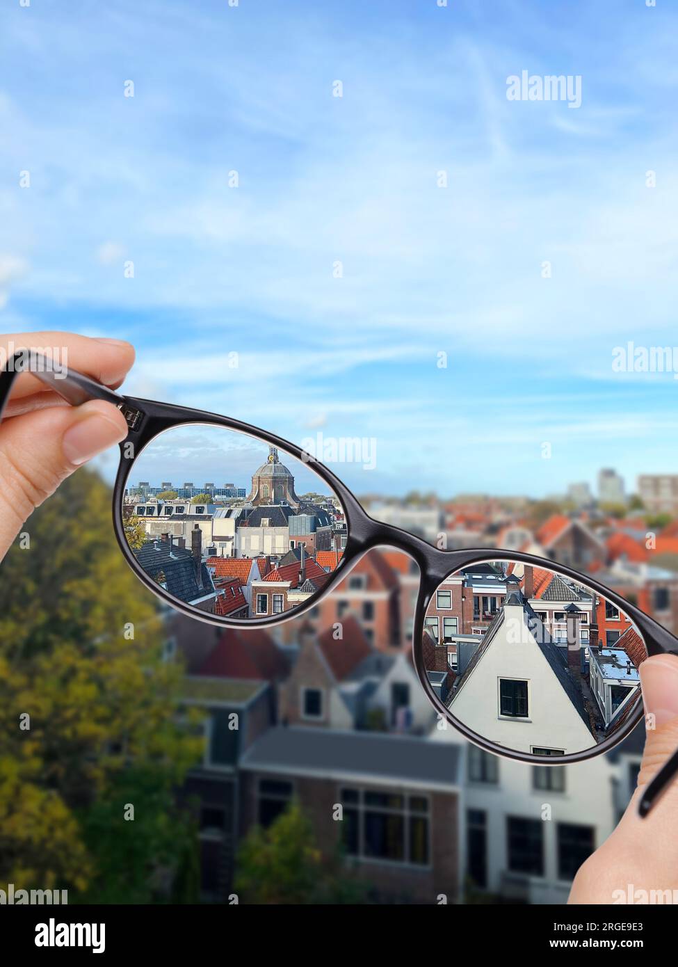 Vision correction. Woman looking through glasses and seeing cityscape ...