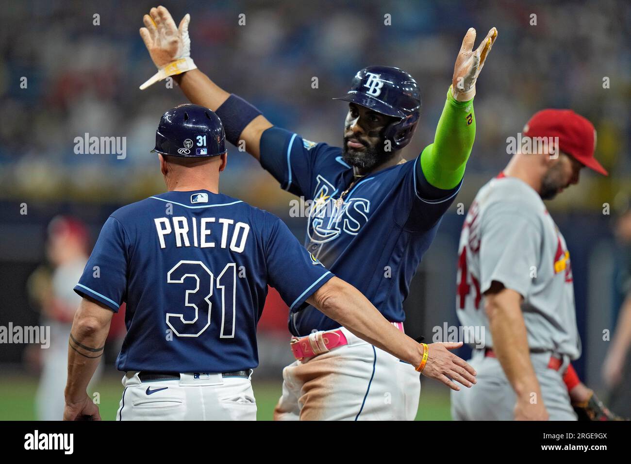 Tampa Bay Rays' Yandy Diaz celebrates with first base coach Chris ...