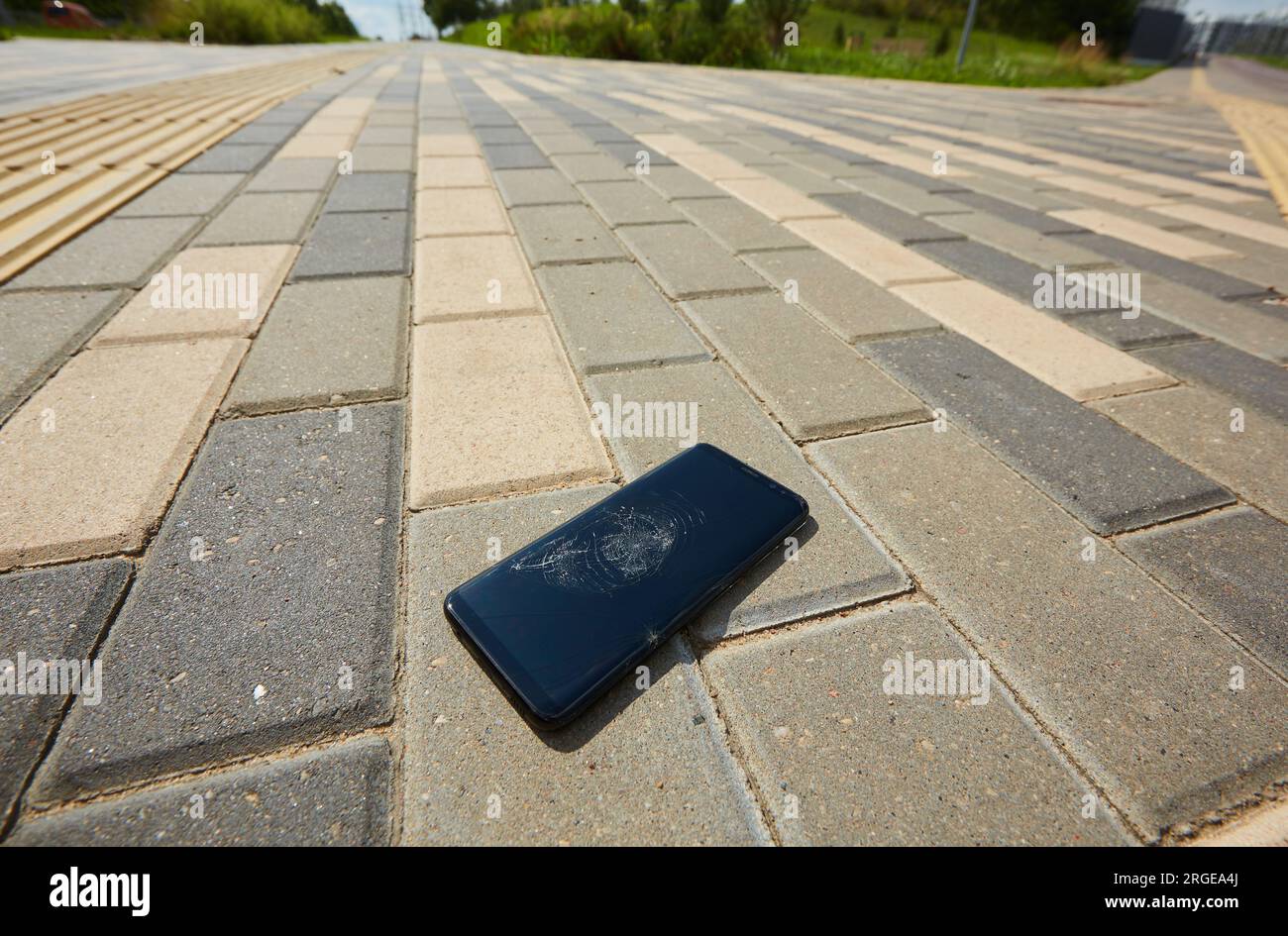 mobile phone fell and crashed on sidewalk. Smartphone with a broken ...