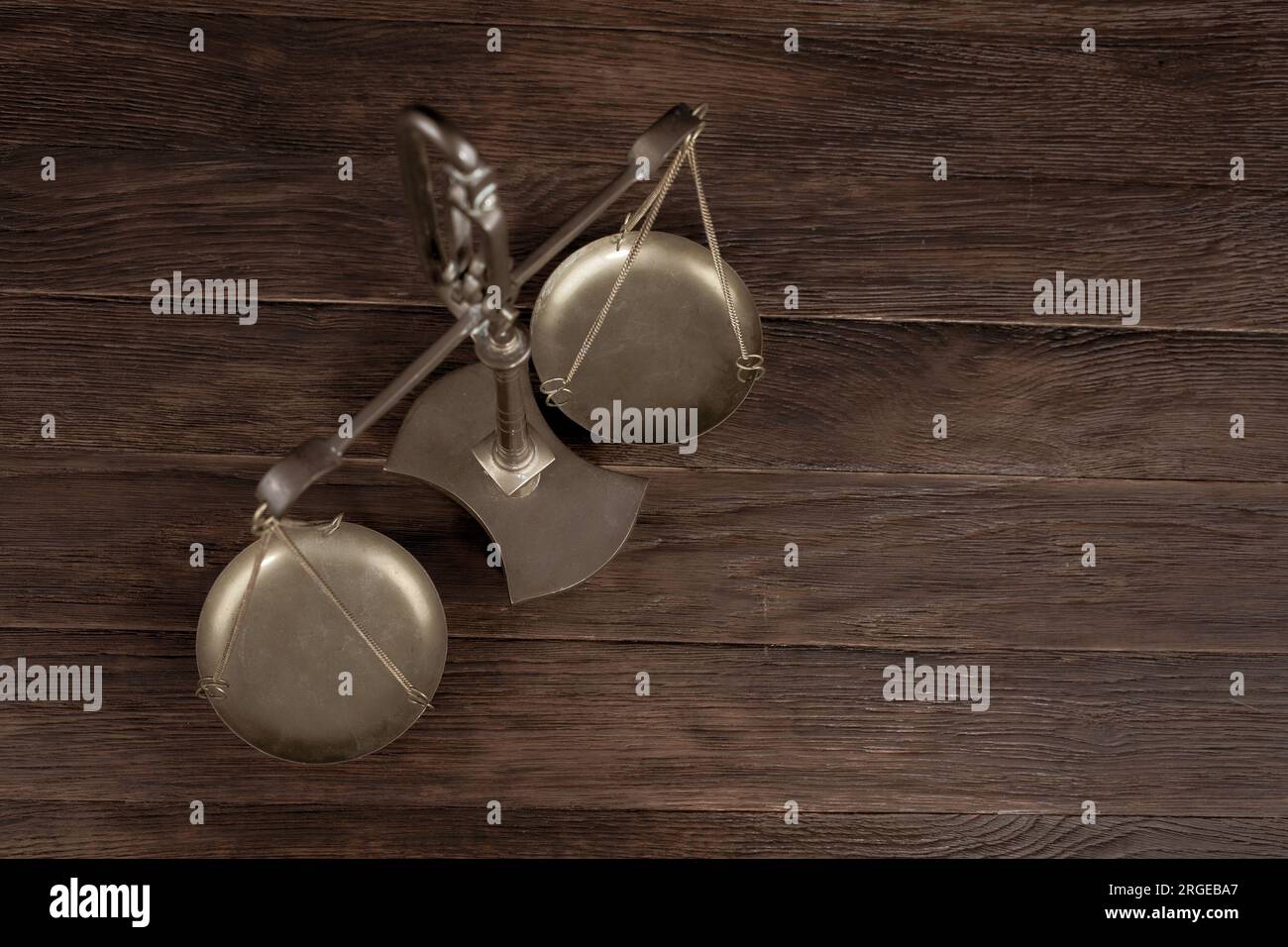 Bronze traditional balance scale on wooden table background Stock Photo ...