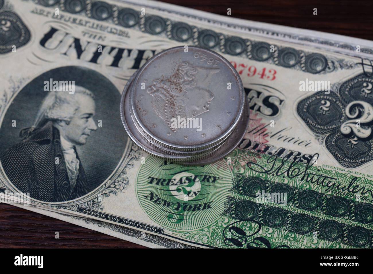 Old west US banknotes and silver certificates with silver dollar coins ...