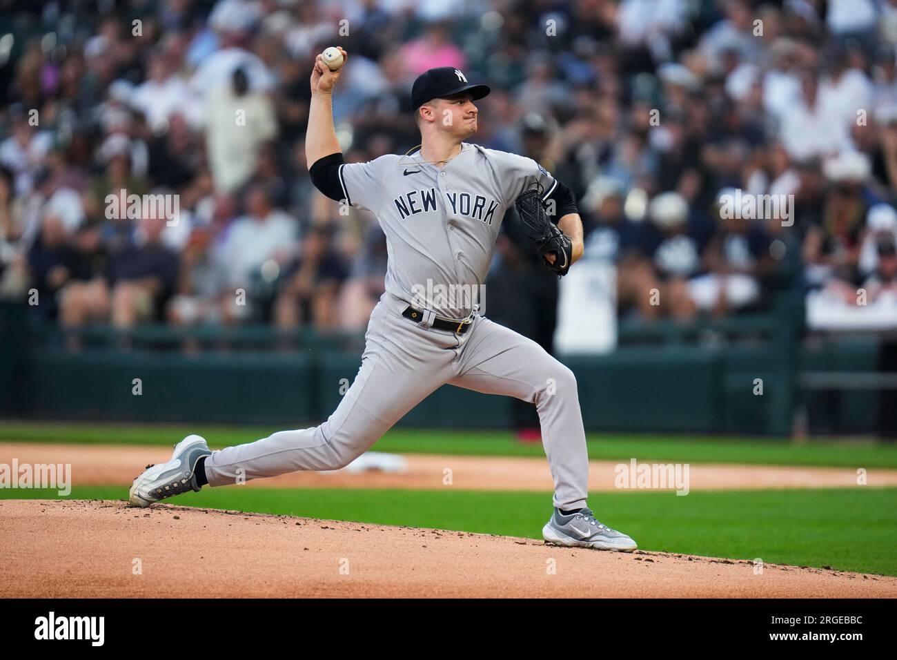 New York Yankees starting pitcher Clarke Schmidt throws to a Chicago White Sox batter during the ...