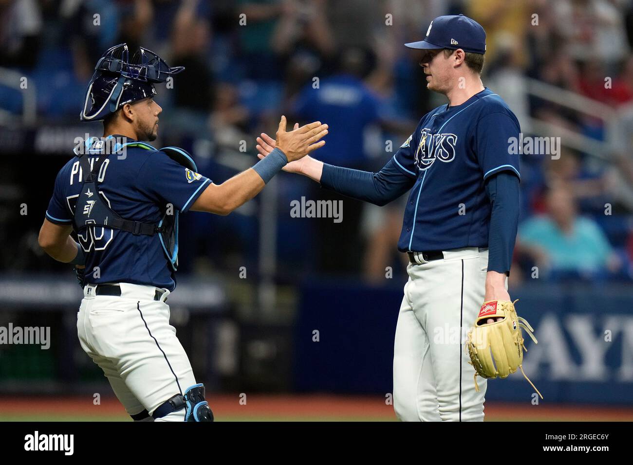 Tampa Bay Rays catcher Rene Pinto (50) and relief pitcher Pete ...