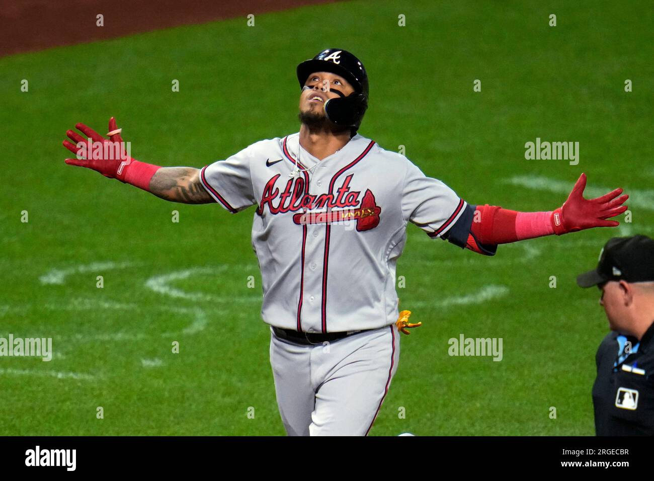 Atlanta Braves' Orlando Arcia celebrates as he crosses home plate after ...