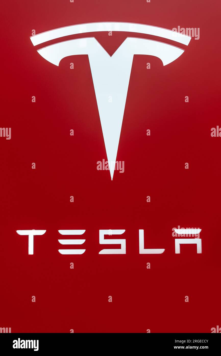 KL ,Malaysia - July 3,2023 : Tesla's logo and brand name on the red ...