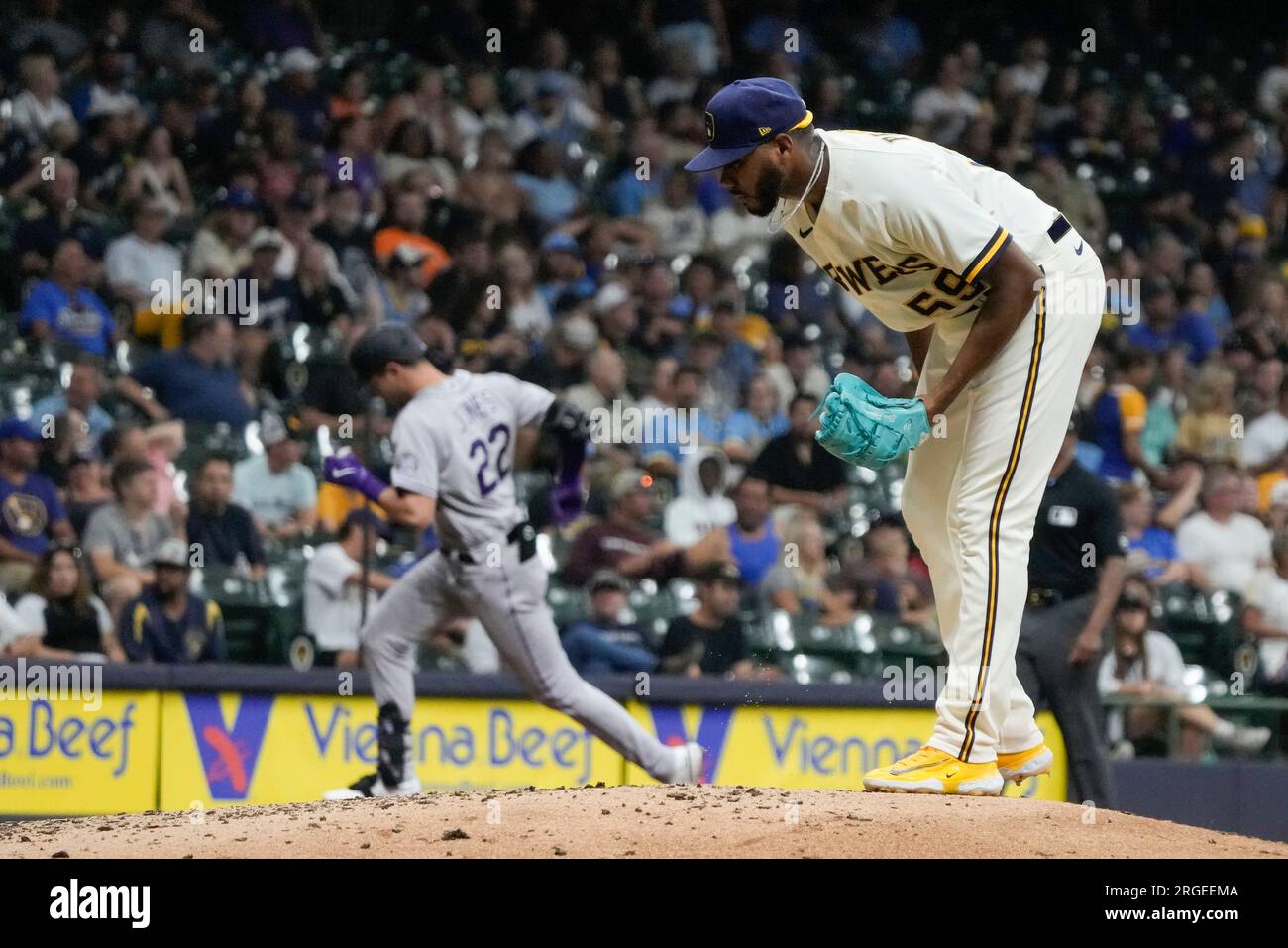 Milwaukee Brewers relief pitcher Elvis Peguero reacts after giving up a ...