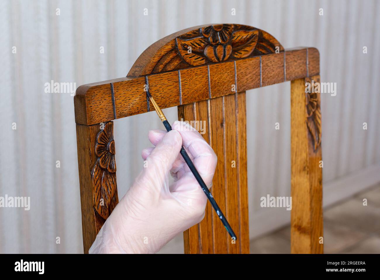 Restoration of an old chair. Varnish Stock Photo - Alamy