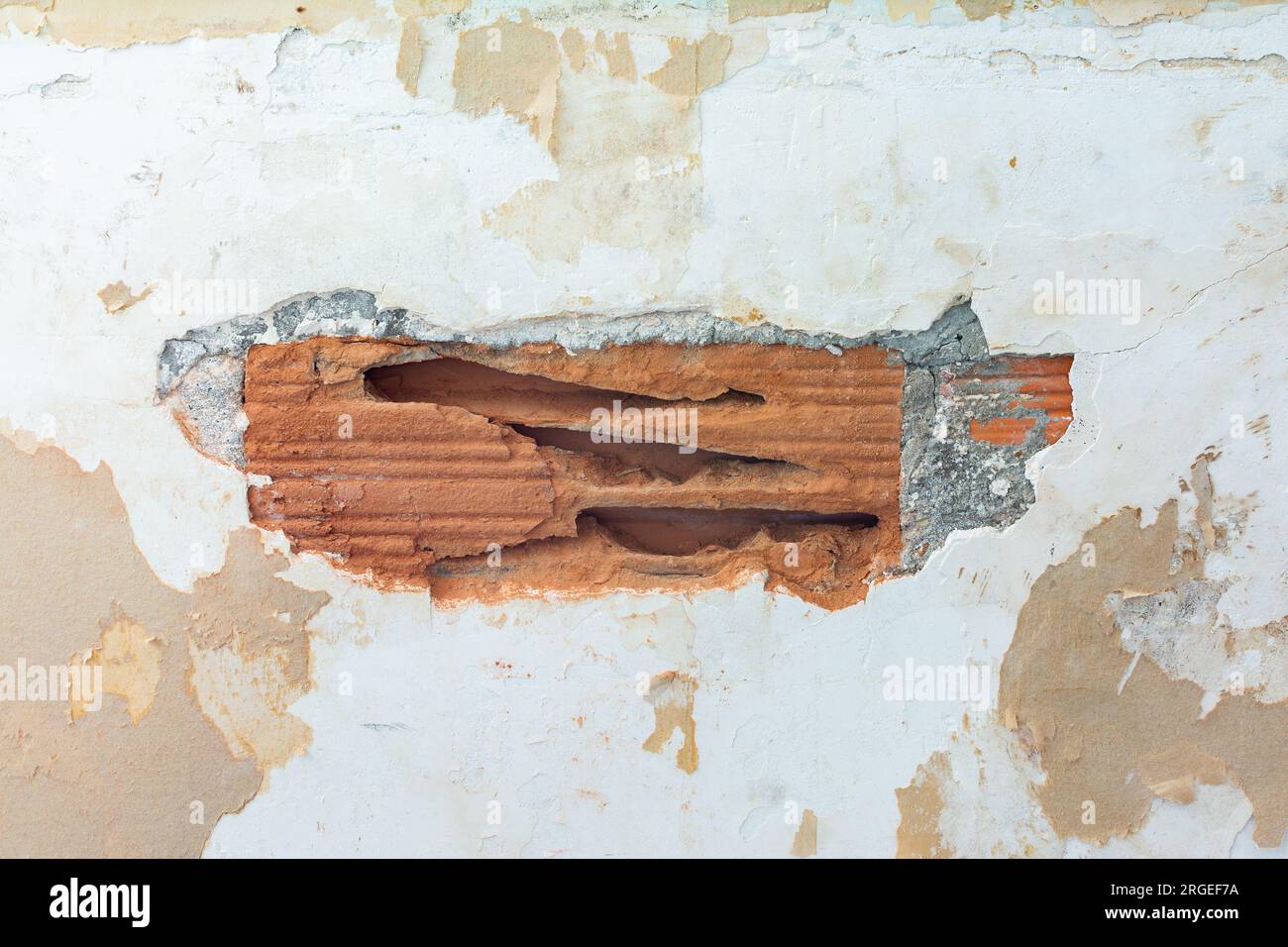 Crumbling bricks of a building inside an apartment. Caused by cracks ...