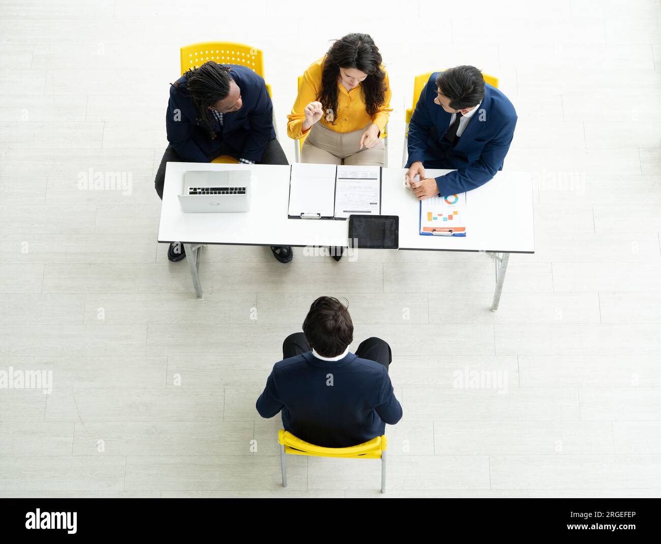 Job interview concept. Diverse hr team doing job interview with a man ...