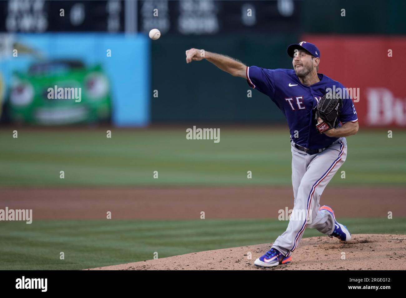 Texas Rangers pitcher Max Scherzer throws to an Oakland Athletics ...