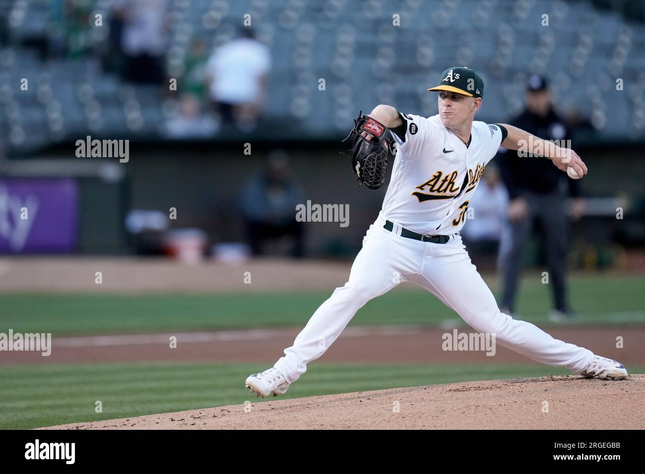 Oakland Athletics pitcher JP Sears throws to a Texas Rangers batter ...