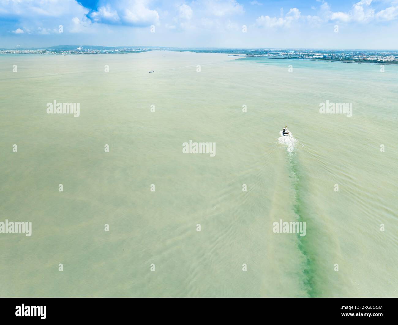Aerial view of the dirty oily stain and pollution on the coast sea ...