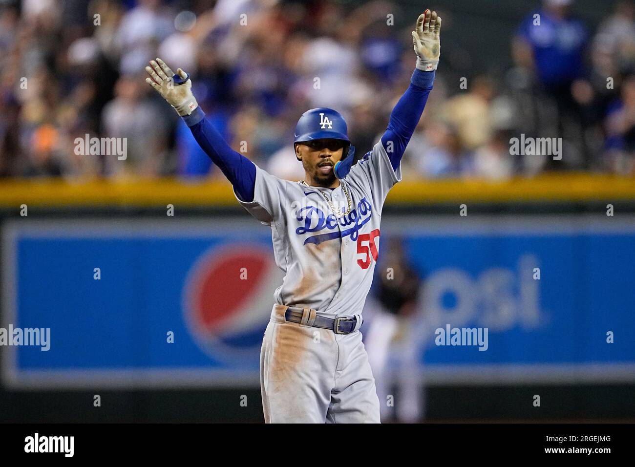 Los Angeles Dodgers' Mookie Betts celebrates his RBI double during the ...