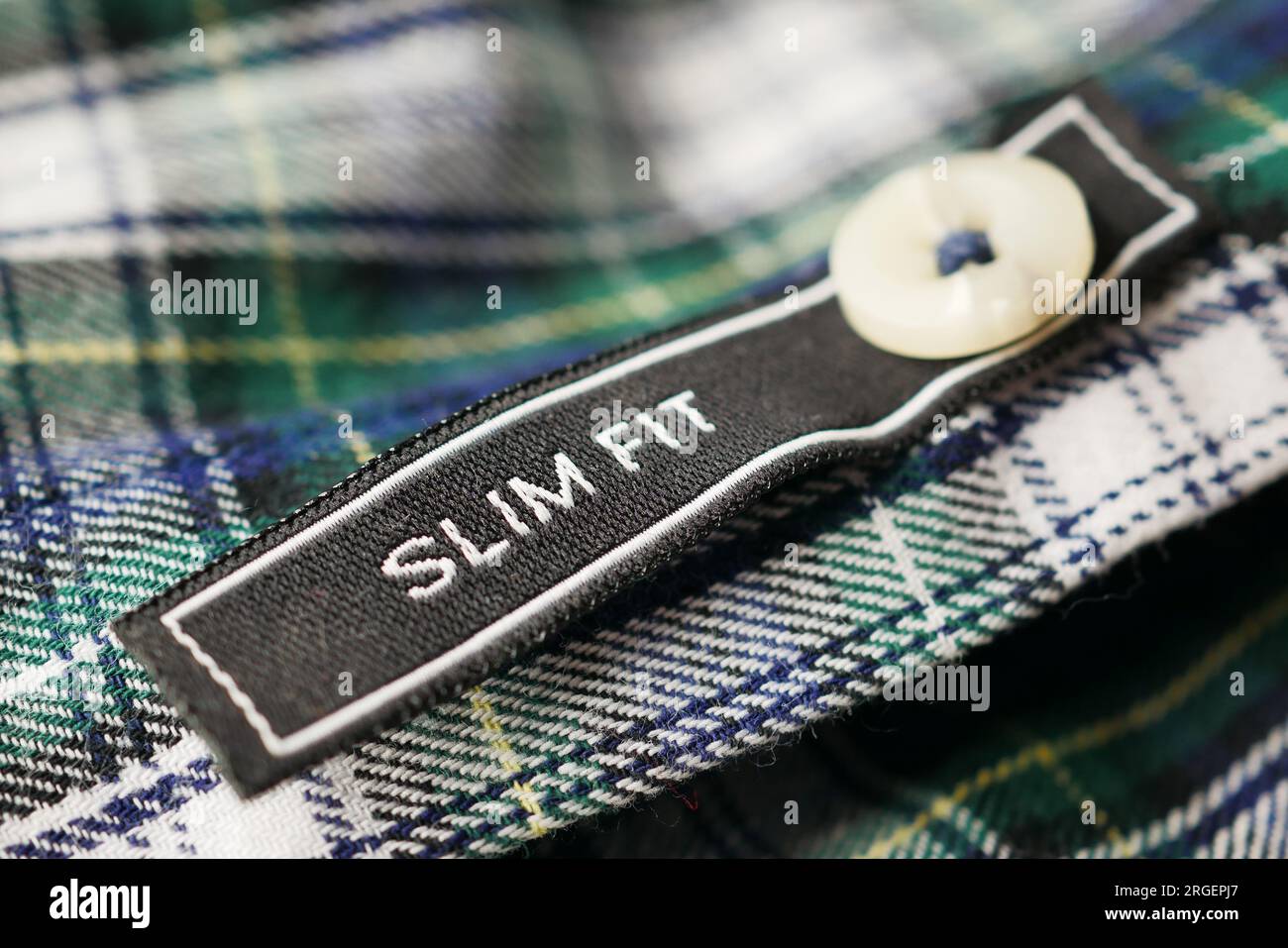 label tag slim fit on a men shirt Stock Photo - Alamy
