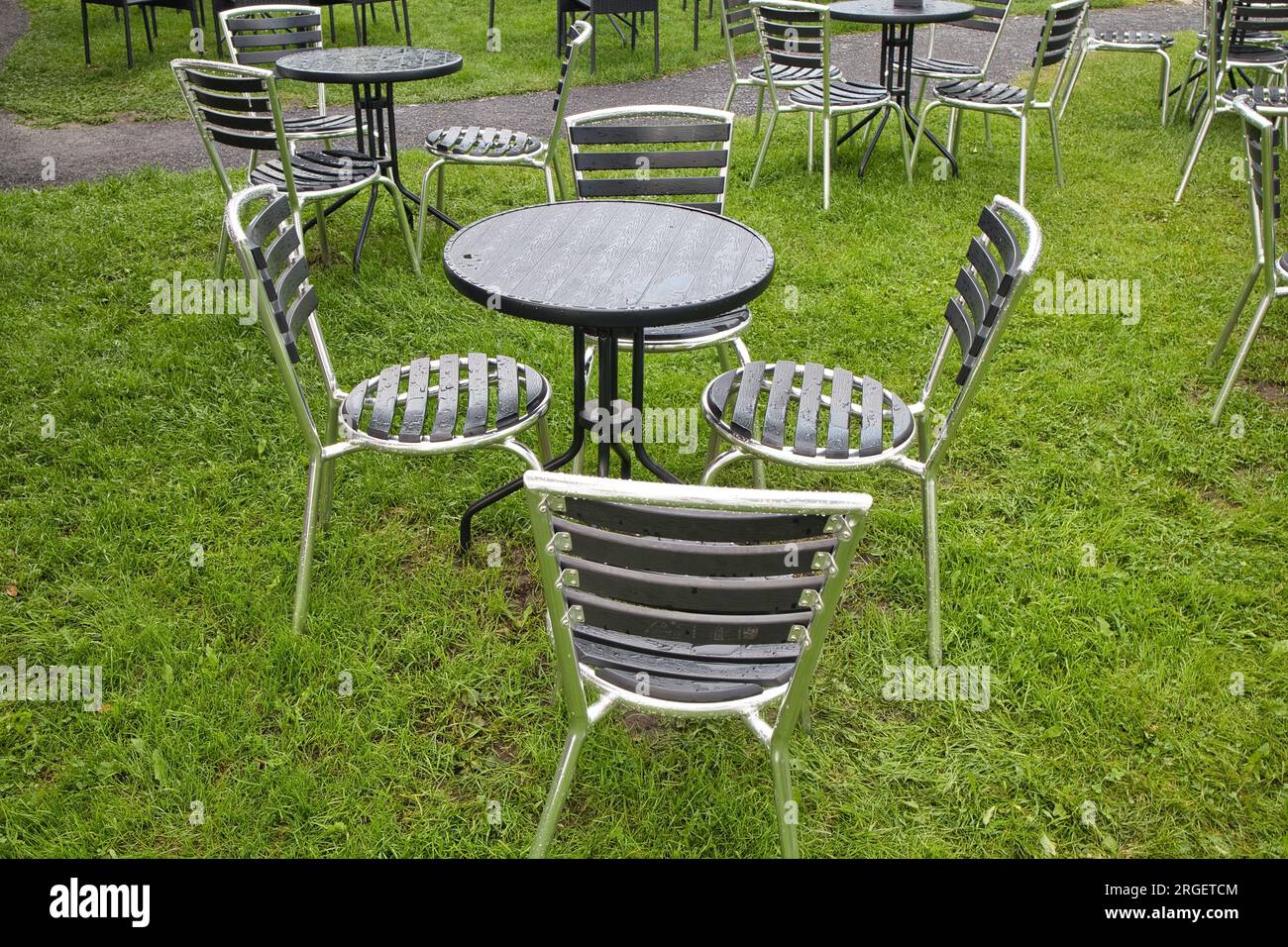 Empty tables and chairs of outdoor cafe after rain Stock Photo - Alamy