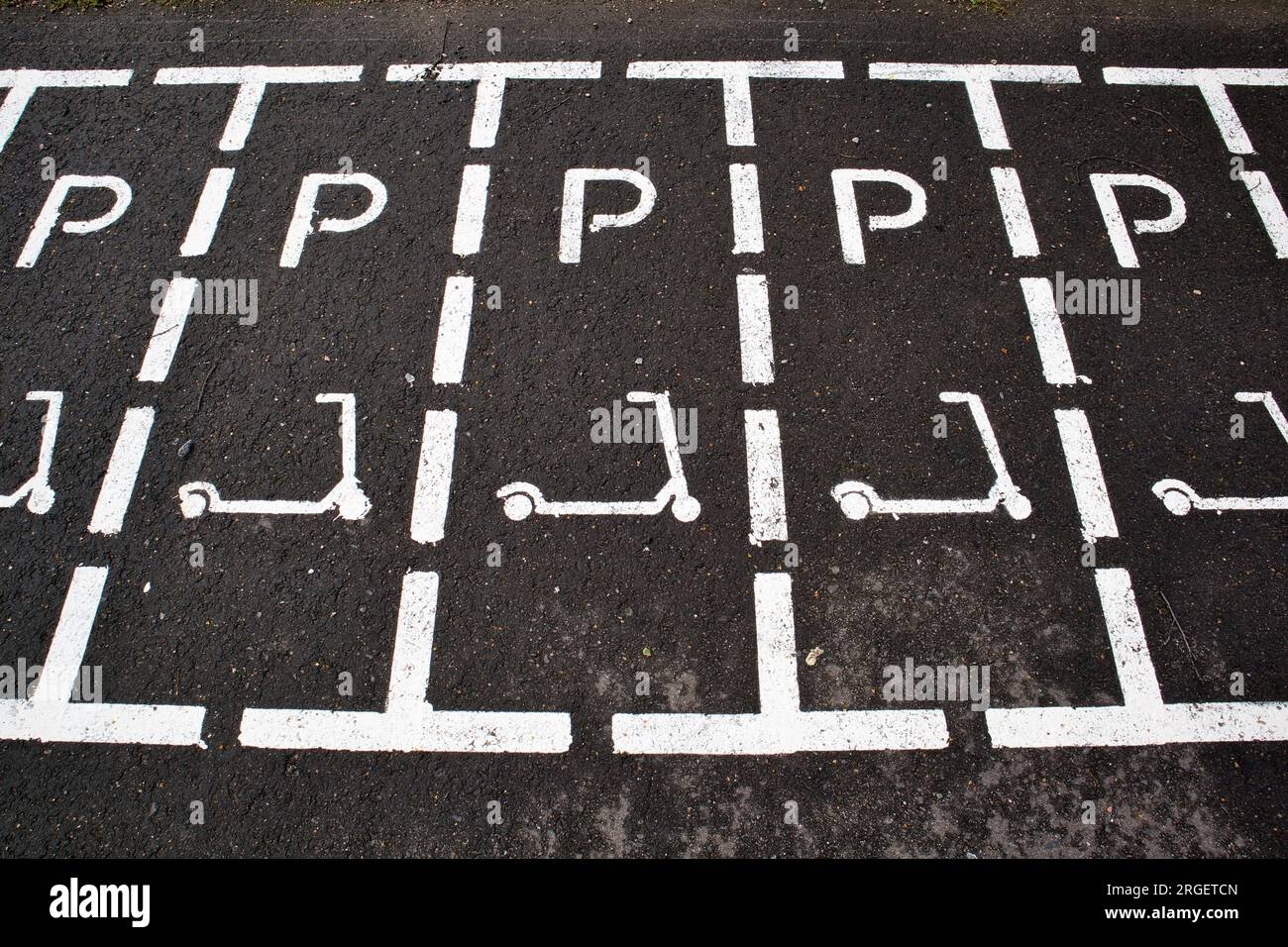 Parking lot sign for scooters Stock Photo - Alamy