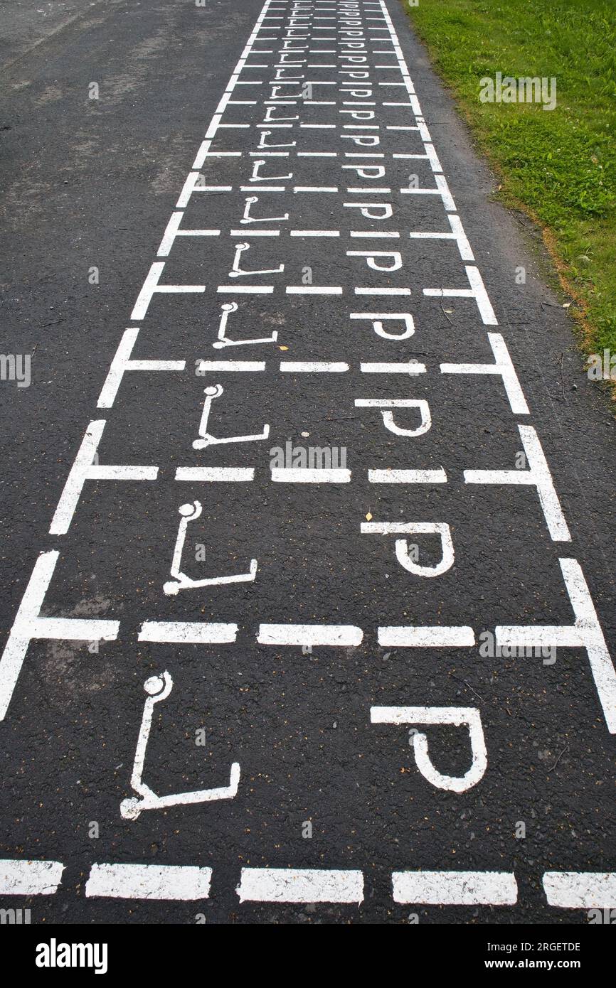 Parking lot sign for scooters Stock Photo - Alamy