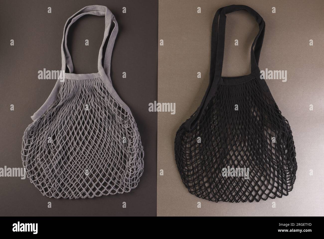 Black and grey mesh net bags with copy space on light and dark brown ...